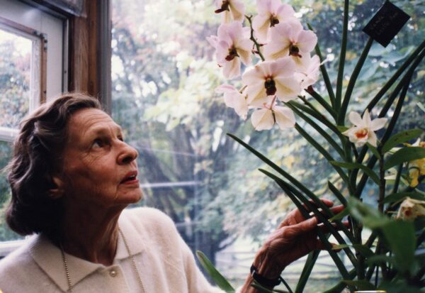 Phyllis Roberts with her orchids - Nomadic Research Labs